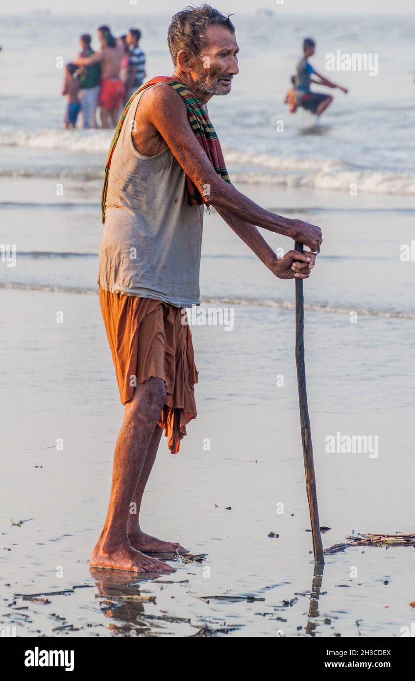 DUBLAR CHAR, BANGLADESH - NOVEMBER 14, 2016: Hindu pilgrim on a beach ...