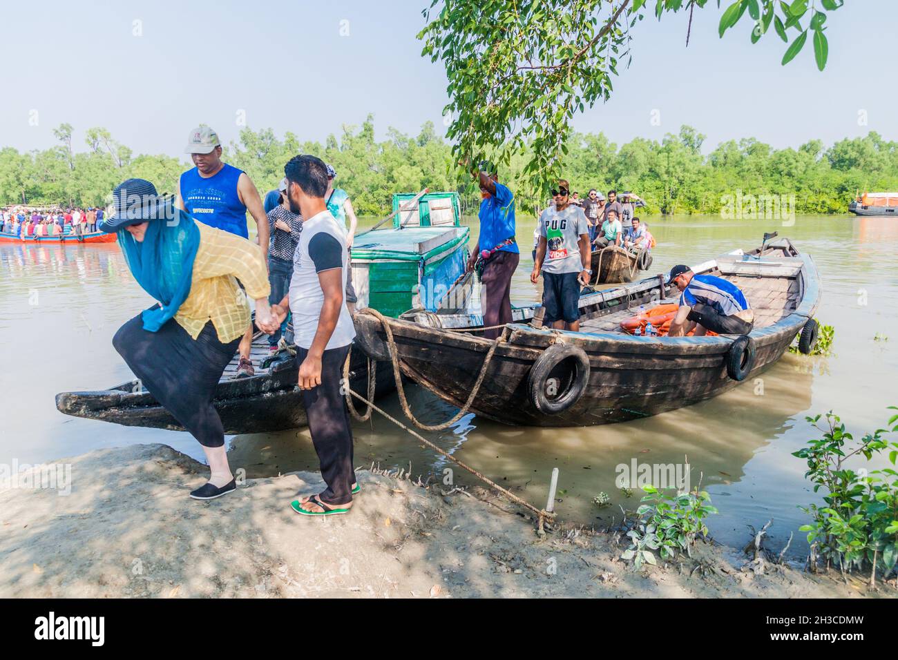HIRON POINT, BANGLADESH - NOVEMBER 14, 2016: Tourists are leaving their boat at Hiron Point in ...