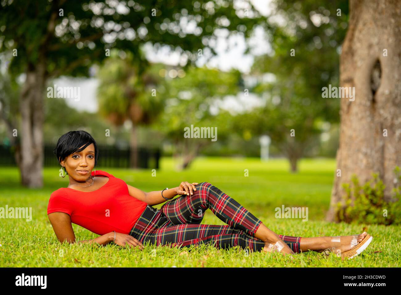 Photo of a beautiful female model posing outdoors in a park scene Stock ...