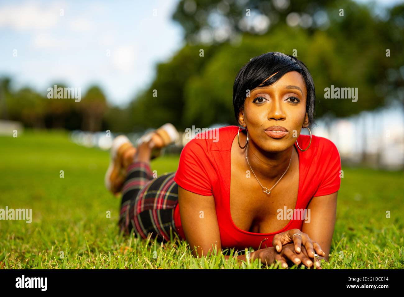 Photo of a beautiful female model posing outdoors in a park scene Stock ...