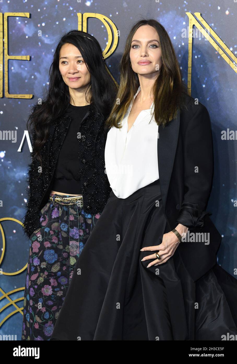 October 27th, 2021. London, UK. Chloe Zhao and Angelina Jolie arriving ...