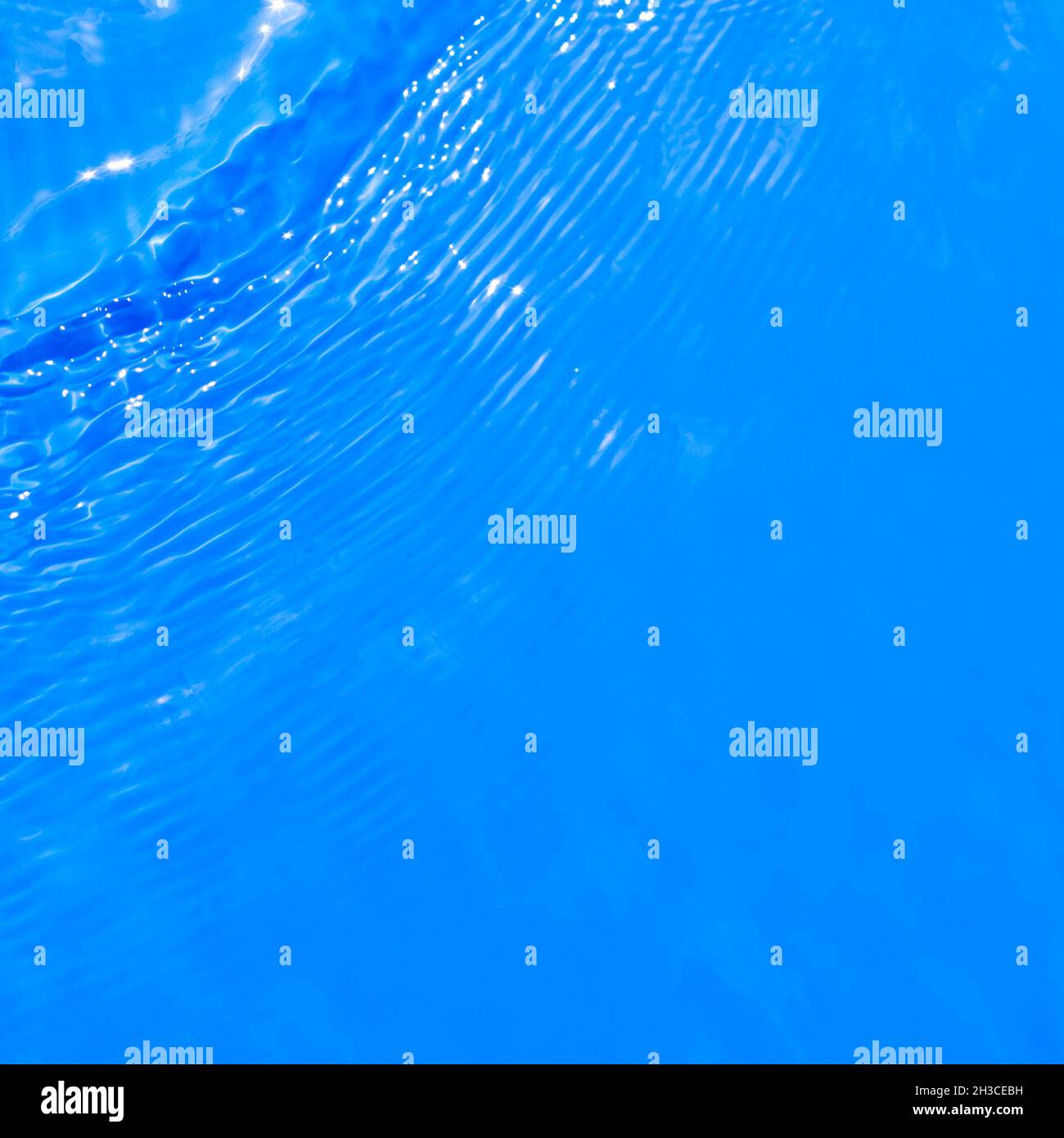 Surface of blue swimming pool water with light reflection. Texture of ...