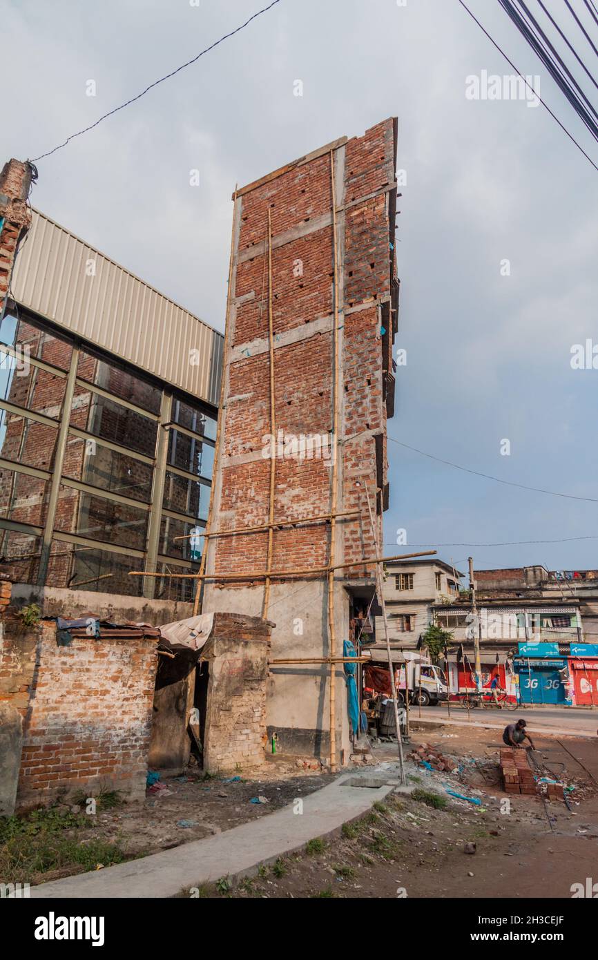 RAJSHAHI, BANGLADESH - NOVEMBER 10, 2016: Tall brick house in Rajshahi ...