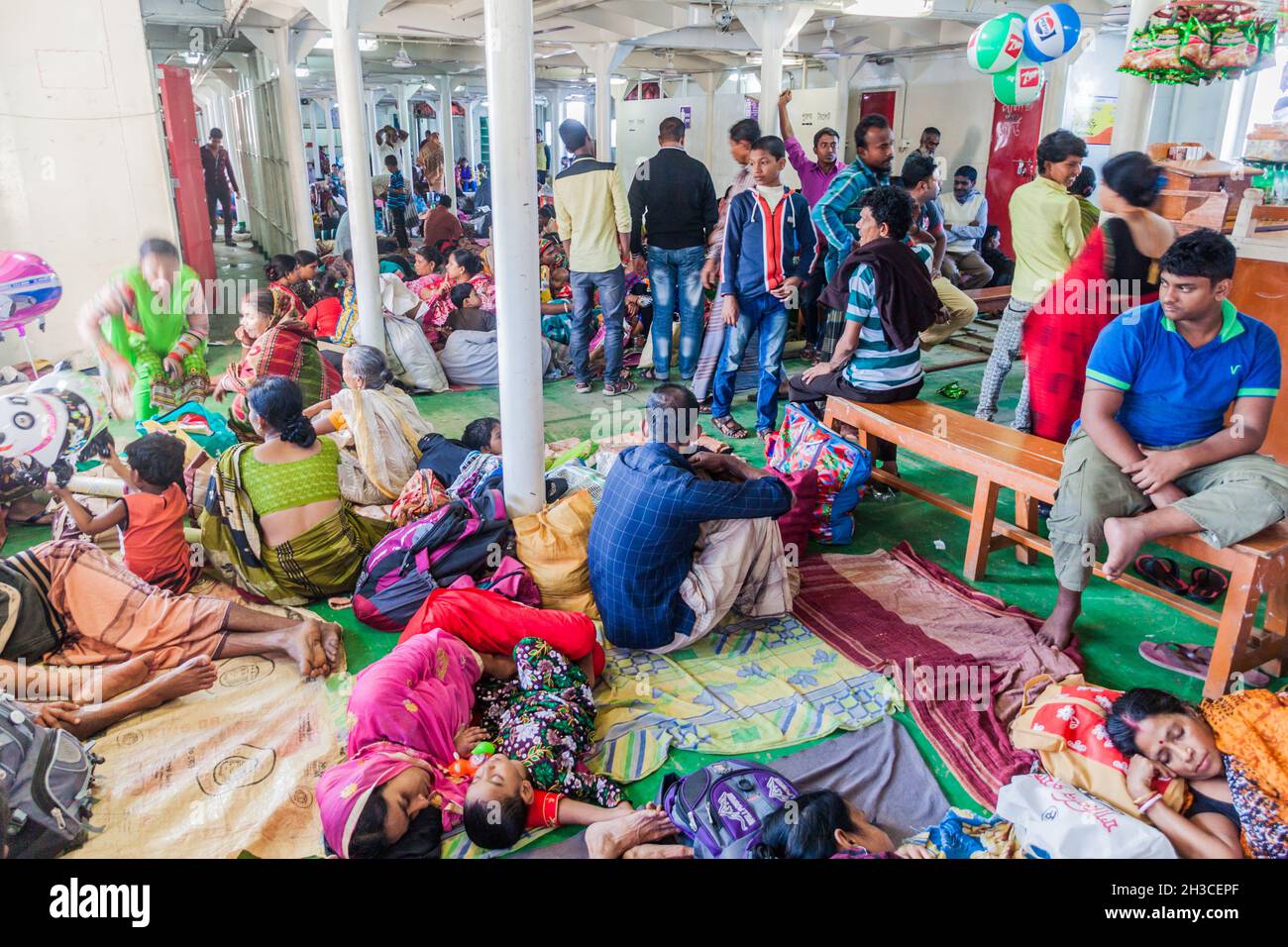 BISHKHALI RIVER, BANGLADESH - NOVEMBER 19, 2016: Passengers of the ...