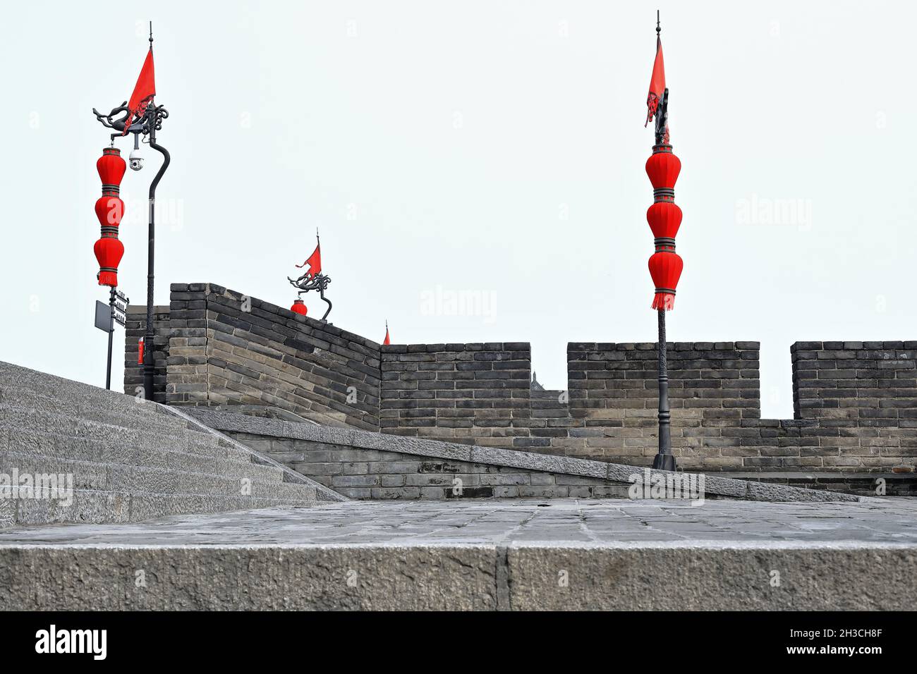 Chinese red lanterns-red flags-battlements and walkway-City Wall's Yongning-South Gate. Xi'an ...