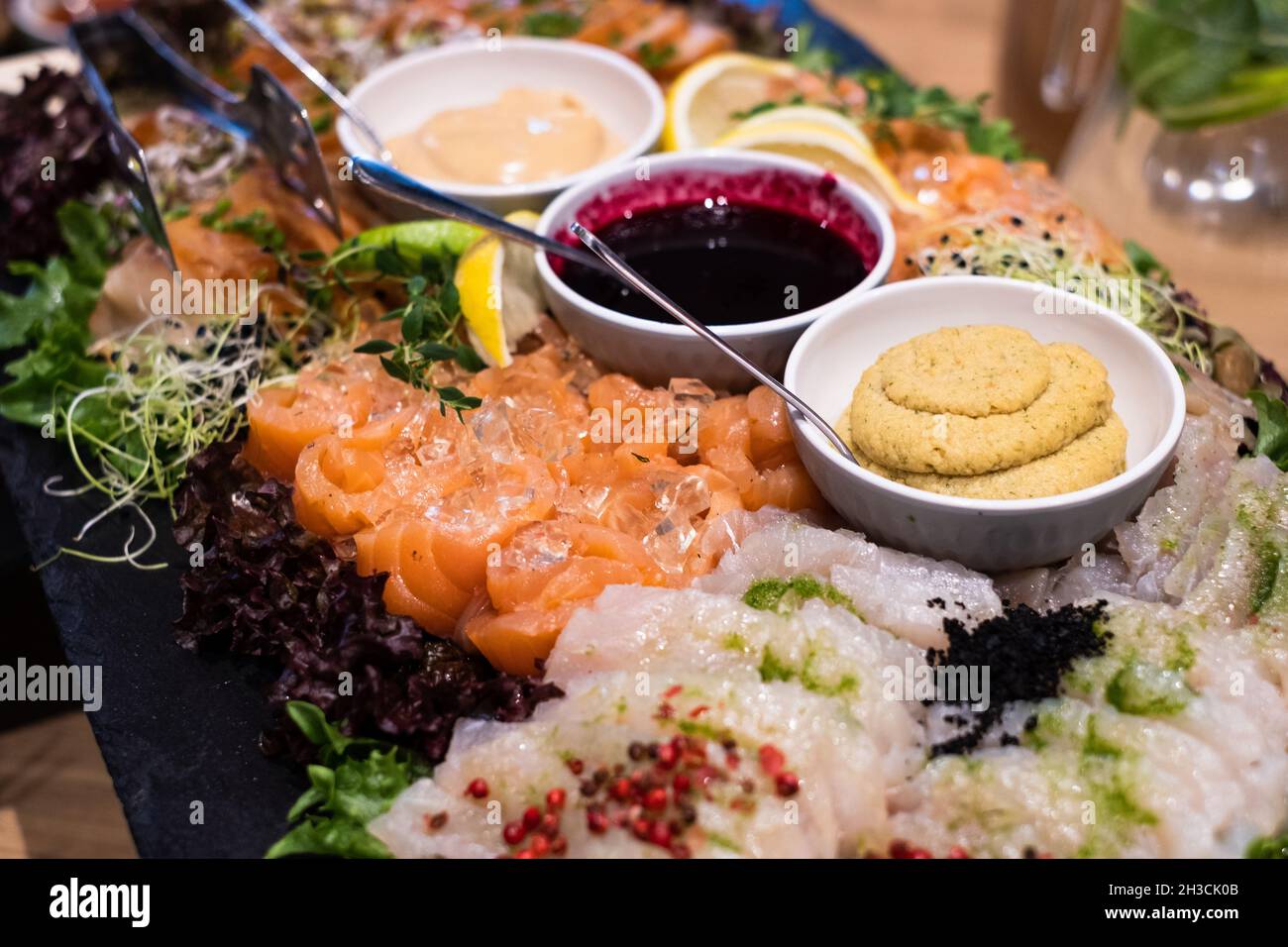 Gravlax salmon fillet, whitefish fillet, hummus, champagne jelly ...