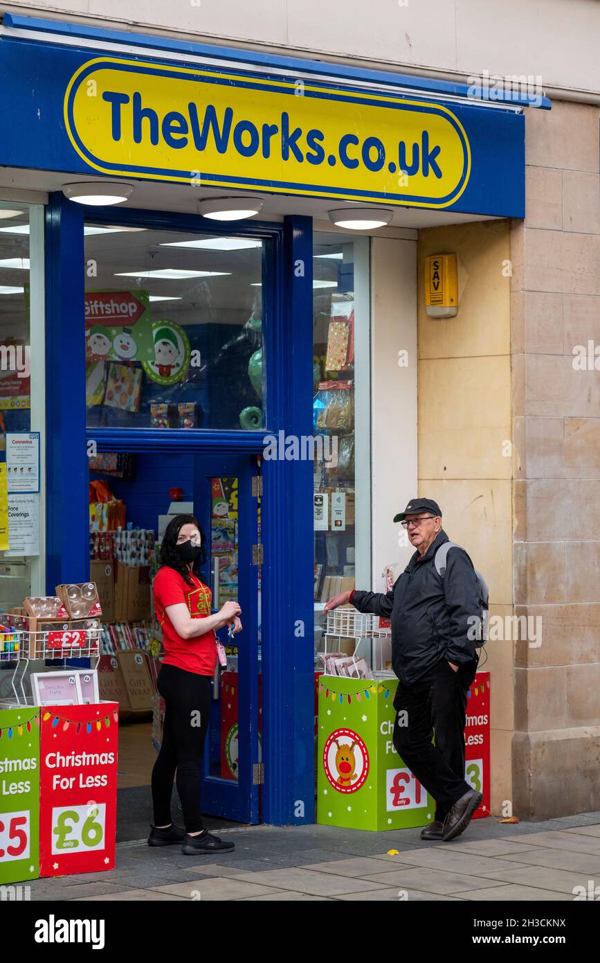 27 October 2021. This is a shopper and a member of staff from a High ...
