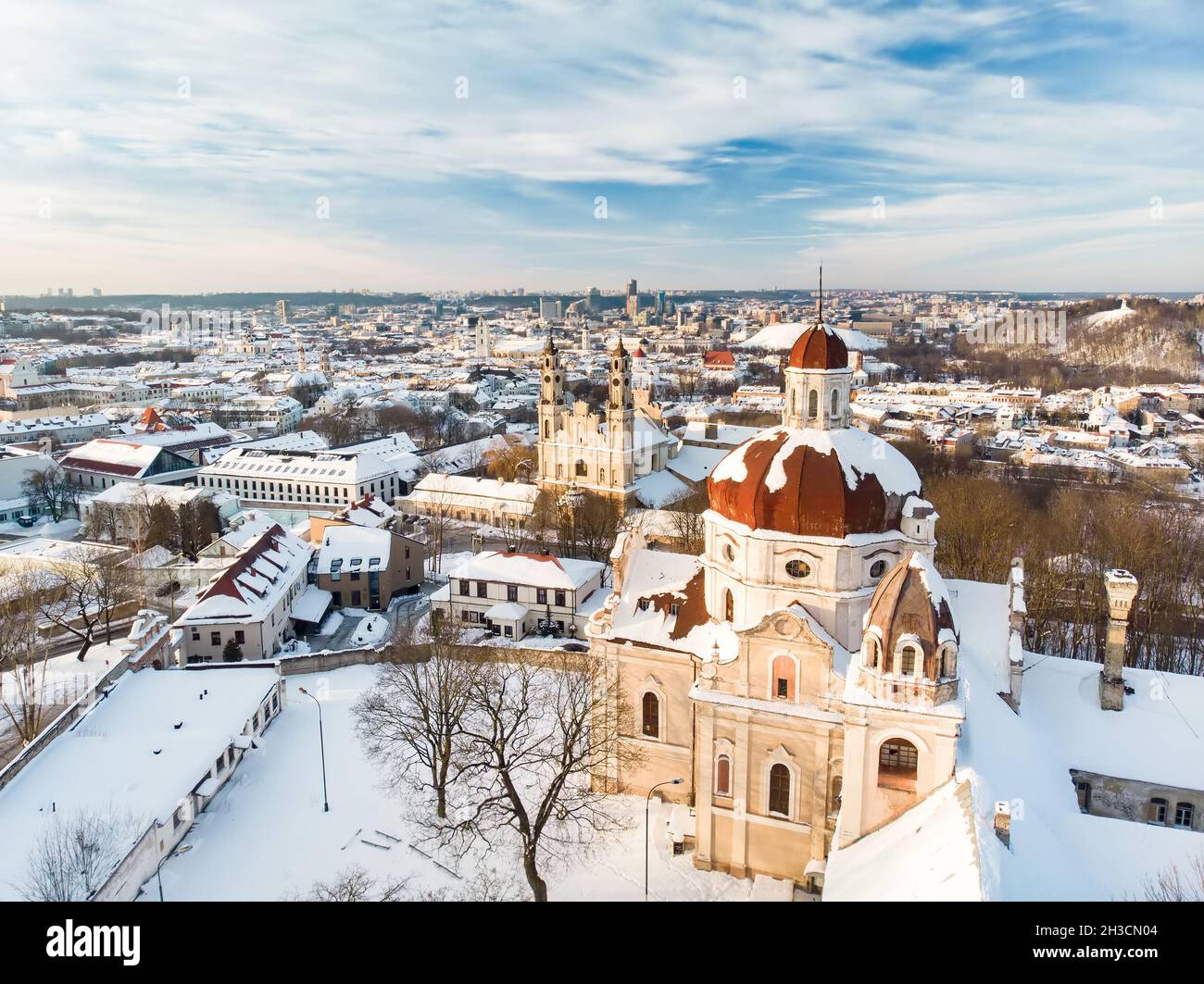 Beautiful Vilnius city panorama in winter with snow covered houses ...