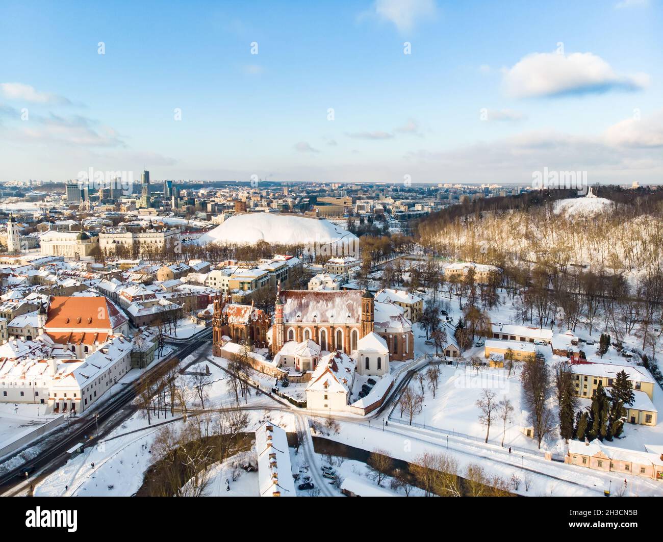 Beautiful Vilnius city panorama in winter with snow covered houses ...