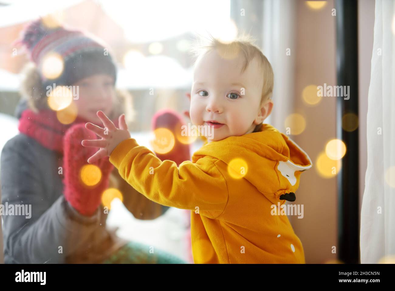 Child hand behind glass hi-res stock photography and images - Alamy