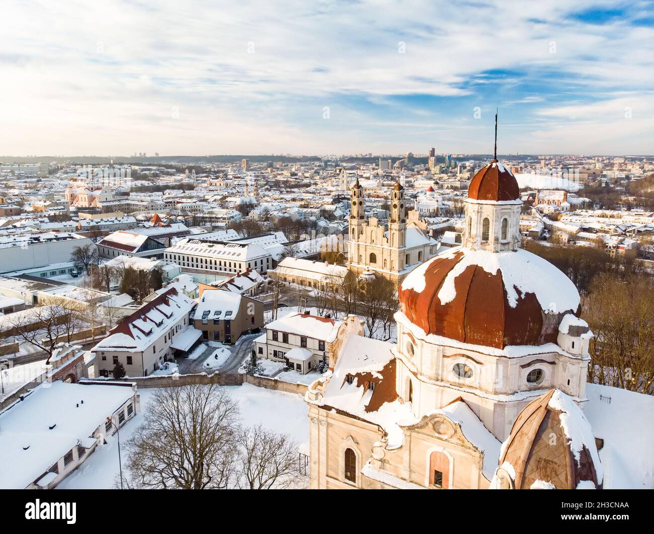 Beautiful Vilnius city panorama in winter with snow covered houses ...