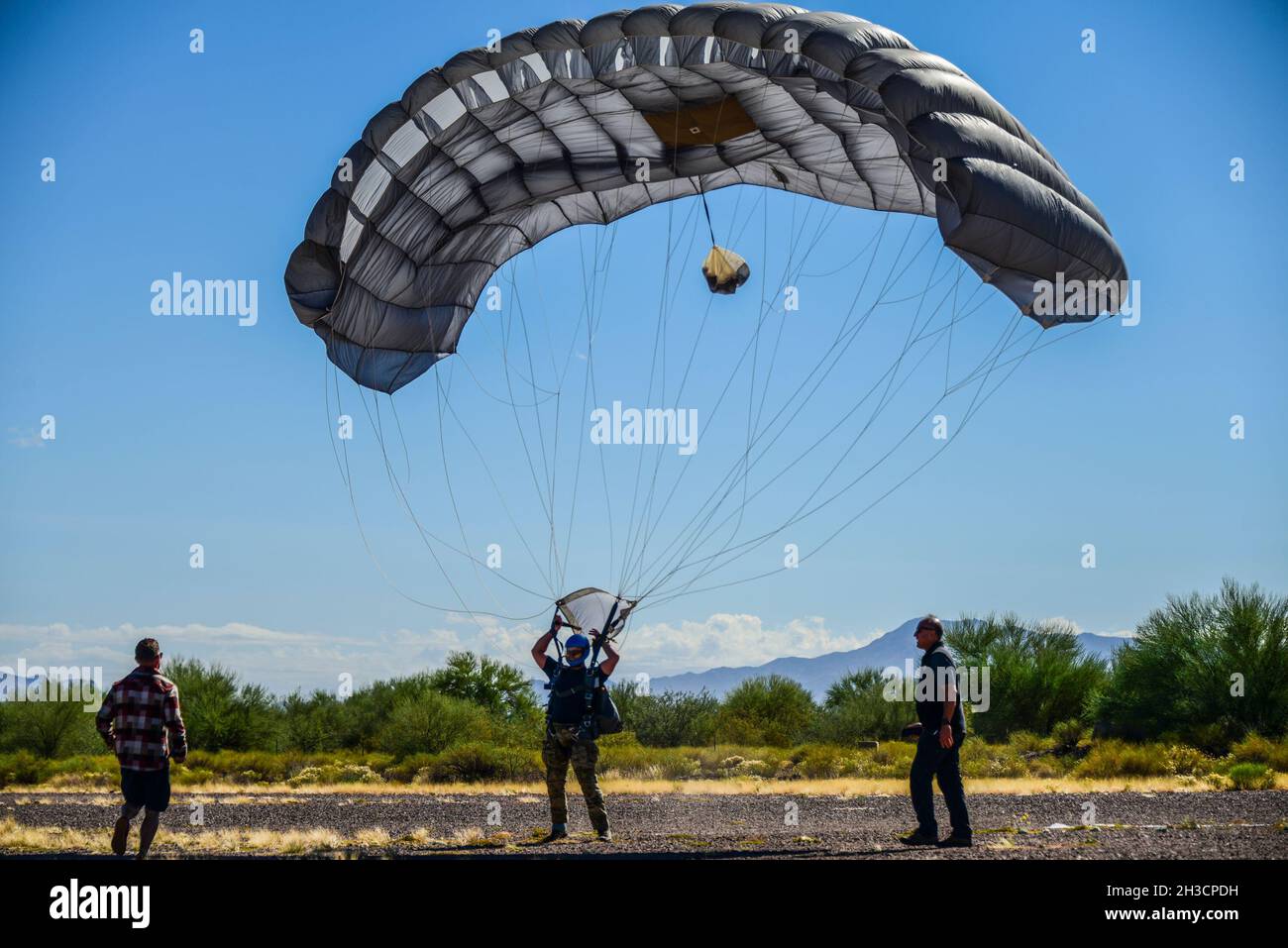U.S. Air Force pararescue jumpers compete in a parachuting competition ...