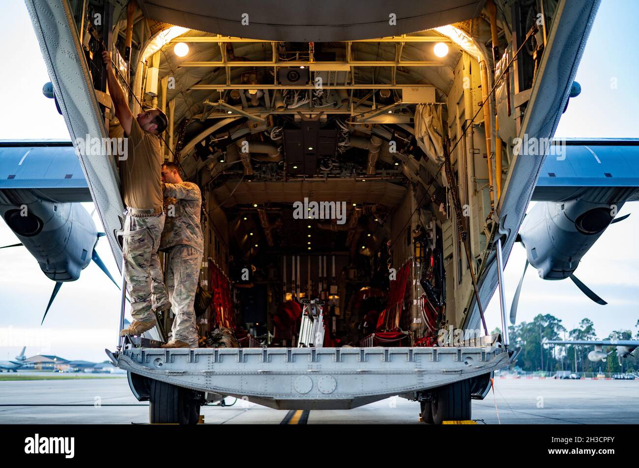 U.S. Air Force Master Sgt. Luis Rodriguez and Tech. Sgt. Michael Mendes ...