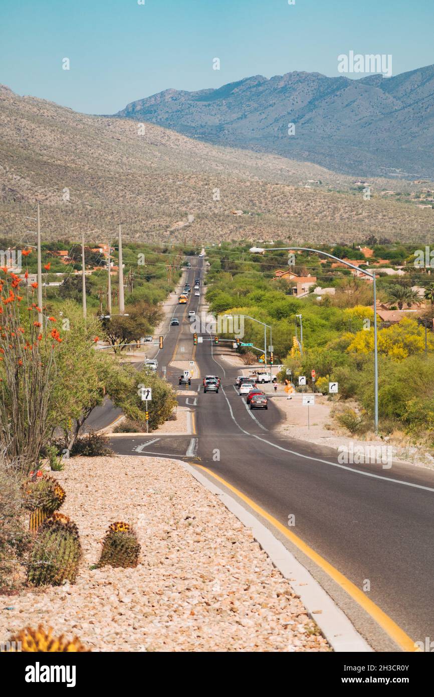 A long four-lane suburban road on the outskirts of Tucson, Arizona ...