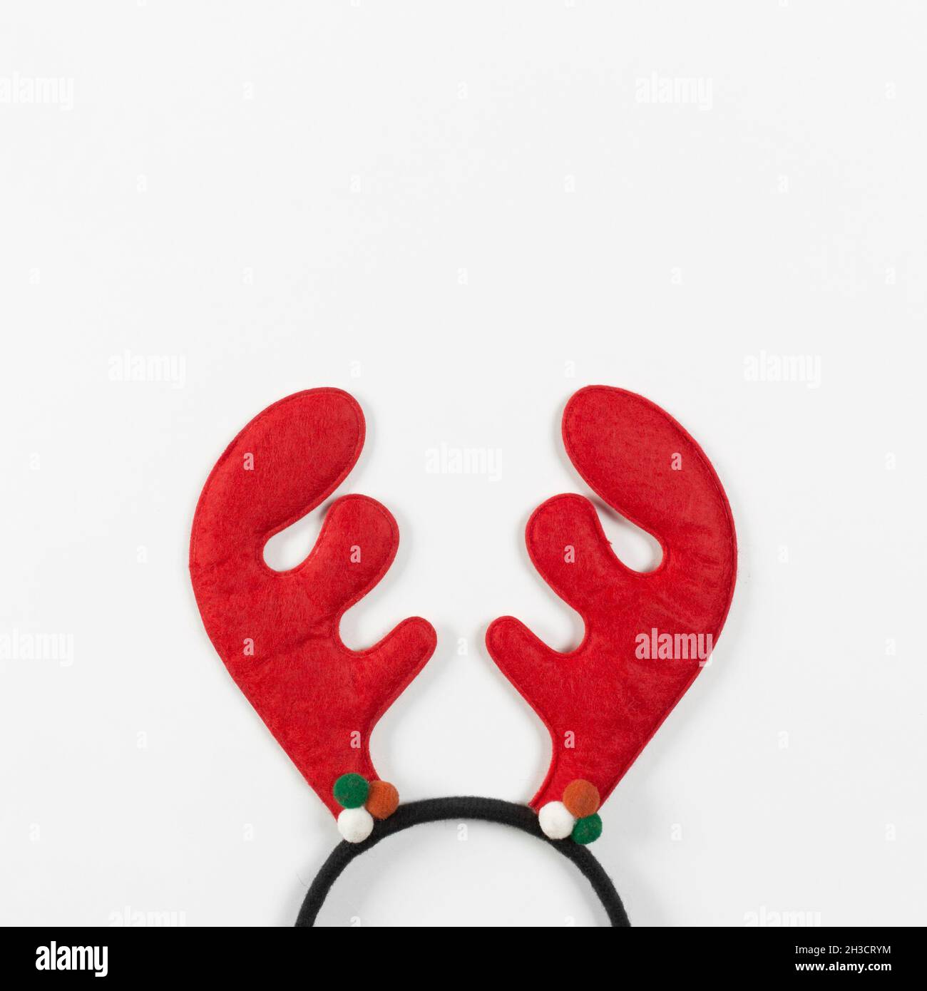 Christmas red reindeer horns on a white background with copy space ...