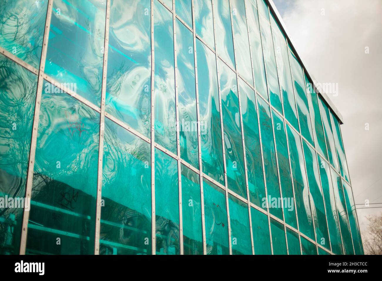 Blue glass building and sky. Panoramic windows. Reflection. Urban ...