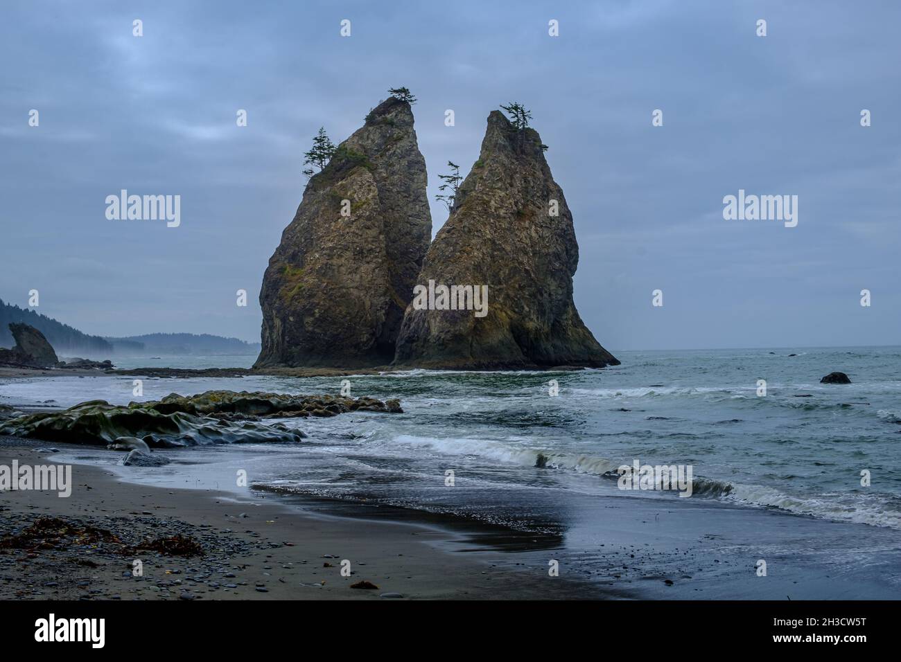 Stormy sky adds a dramatic flair to the twin sea stacks at Olympic ...