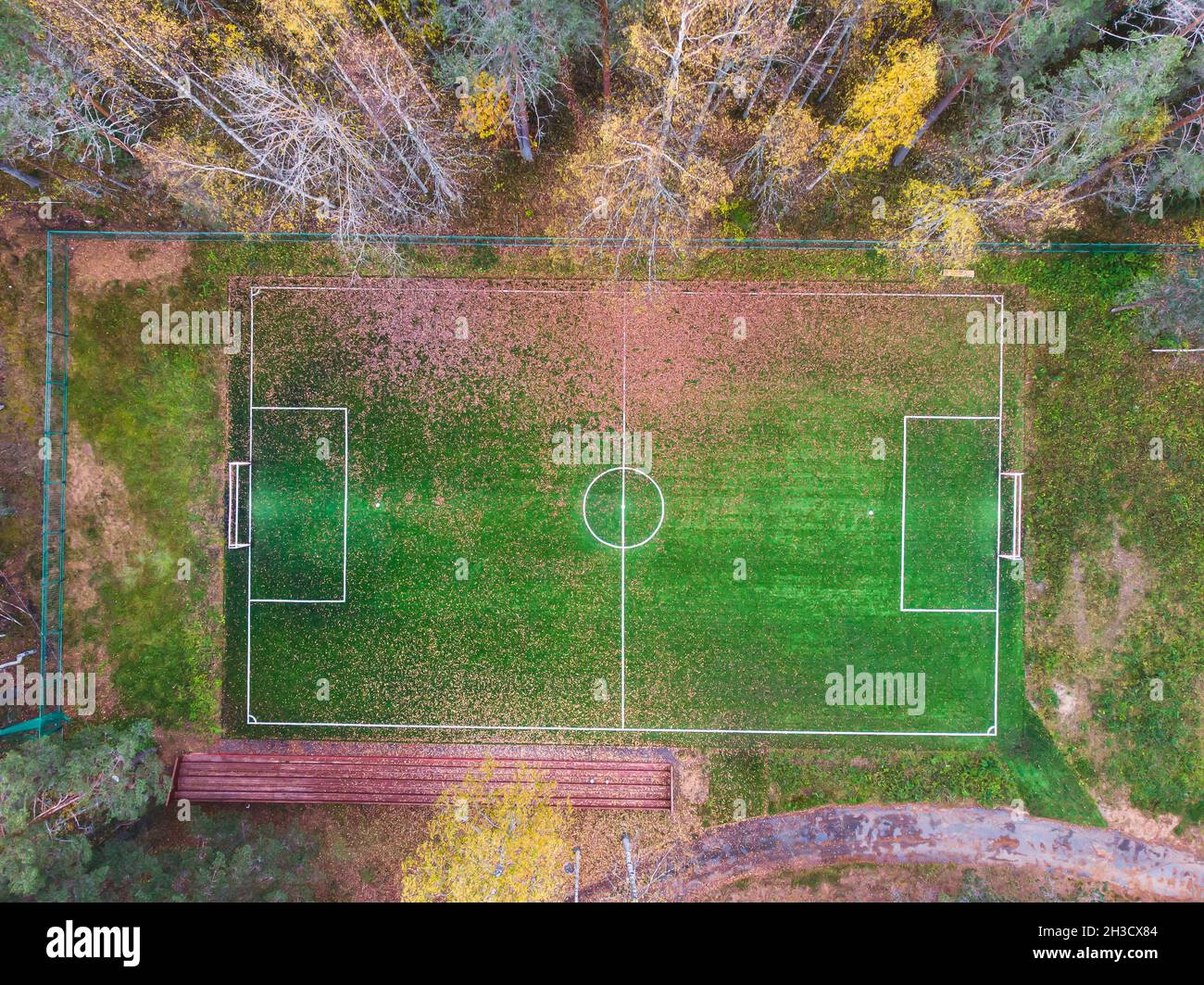 Aerial drone view of football soccer pitch field, green grass fall ...