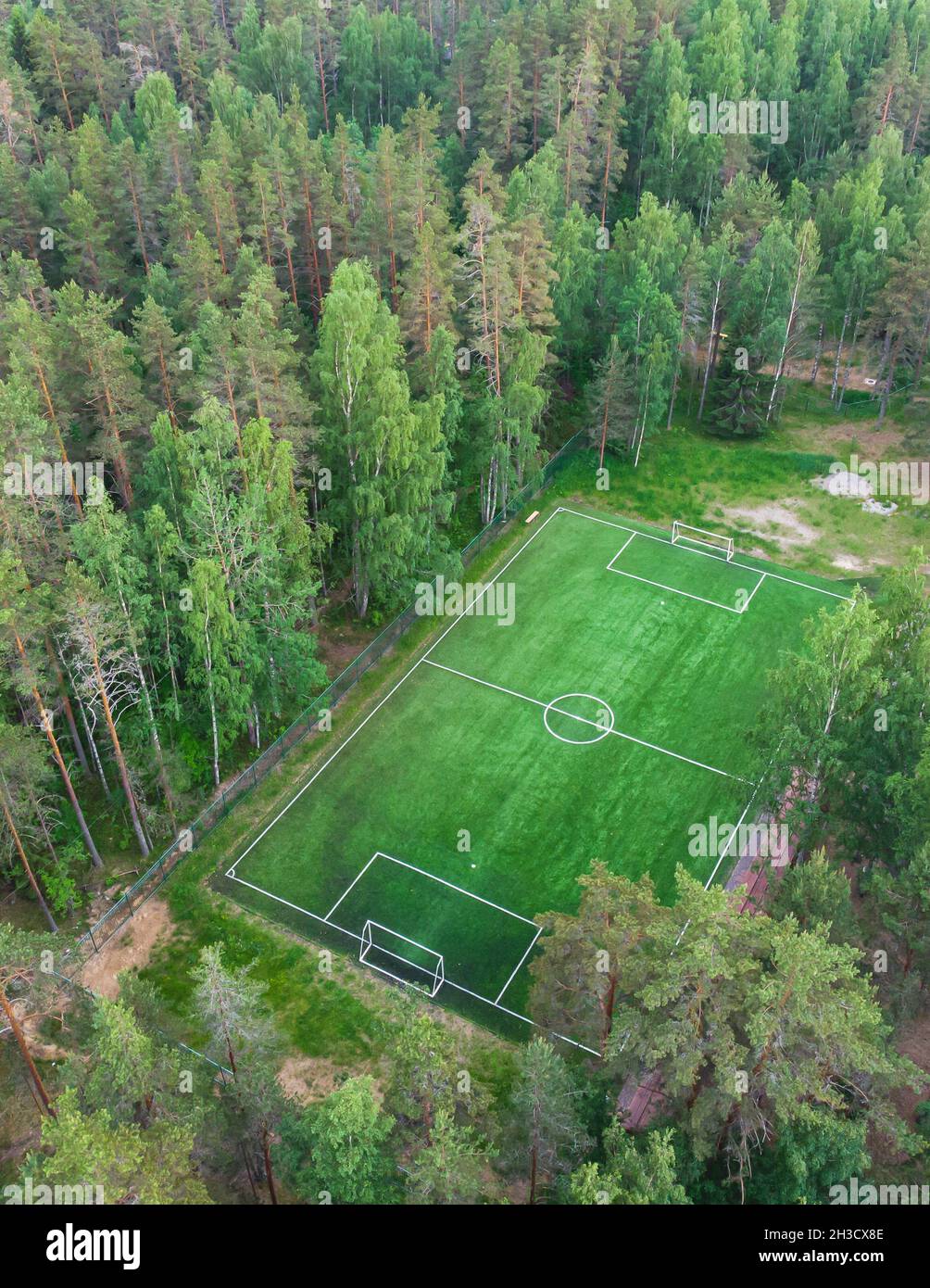 Aerial drone view of football soccer pitch field, green grass summer ...