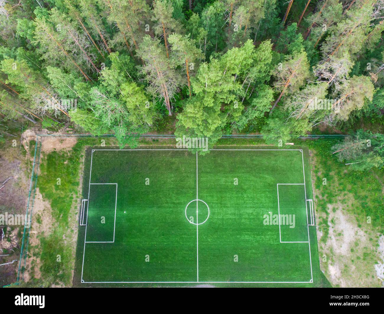 Aerial drone view of football soccer pitch field, green grass summer ...