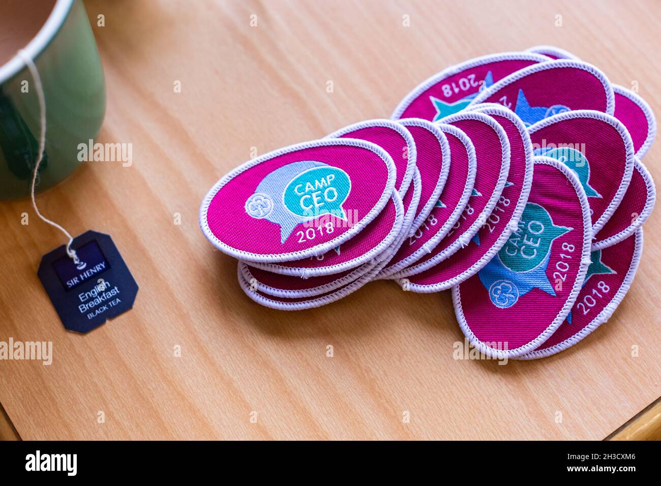 Girlguiding Camp CEO badge on table Stock Photo - Alamy