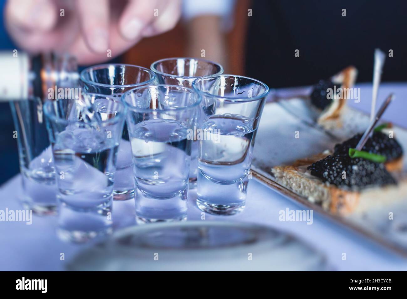 View of alcohol setting on catering banquet table, row line of an ice ...