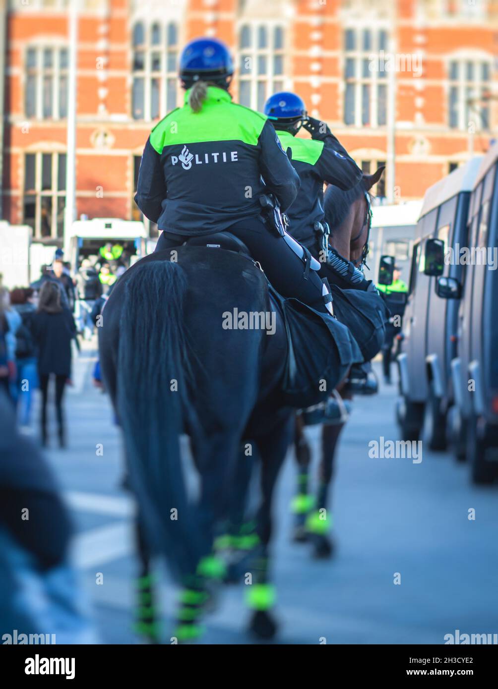 Dutch police squad formation and horseback riding mounted police back ...