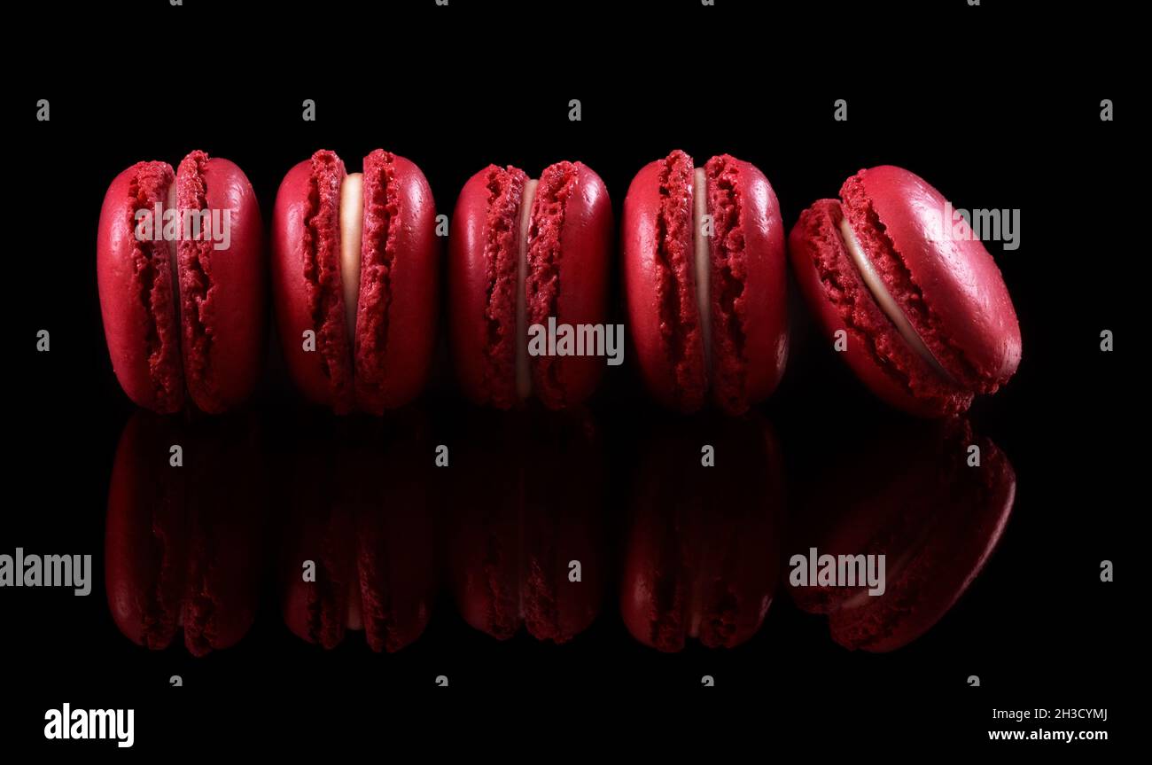 Red French Macarons on Black Background. High quality photo Stock Photo ...