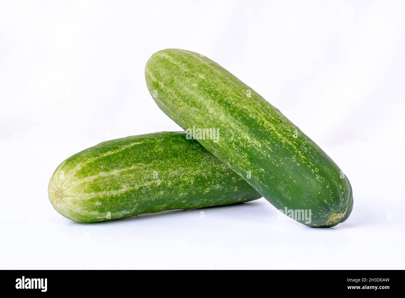 Two cucumbers for fresh vegetables, isolated on a white background ...