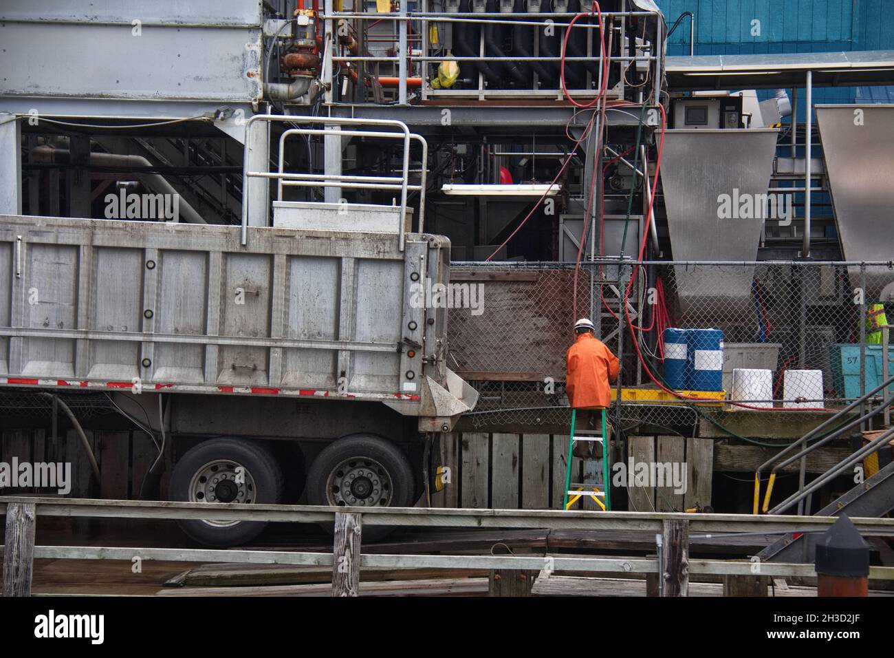 morning activity on a fishermen's loading dock Stock Photo - Alamy