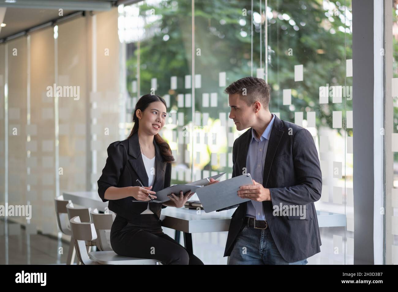 Team of coworkers making great business discussion in modern coworking ...
