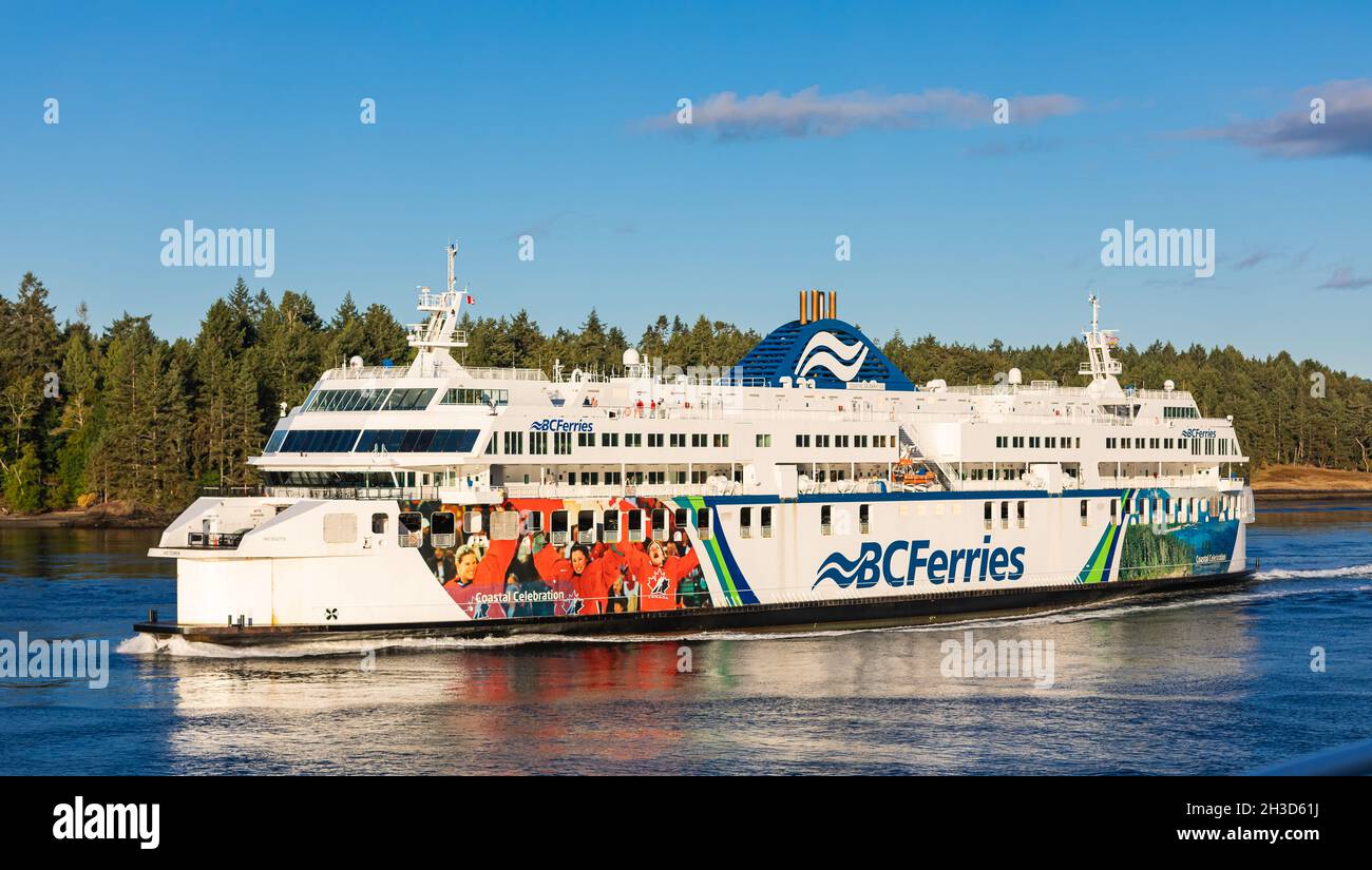 Ferry in front of Coast Mountains. BC Ferry crossing the strait in gulf ...
