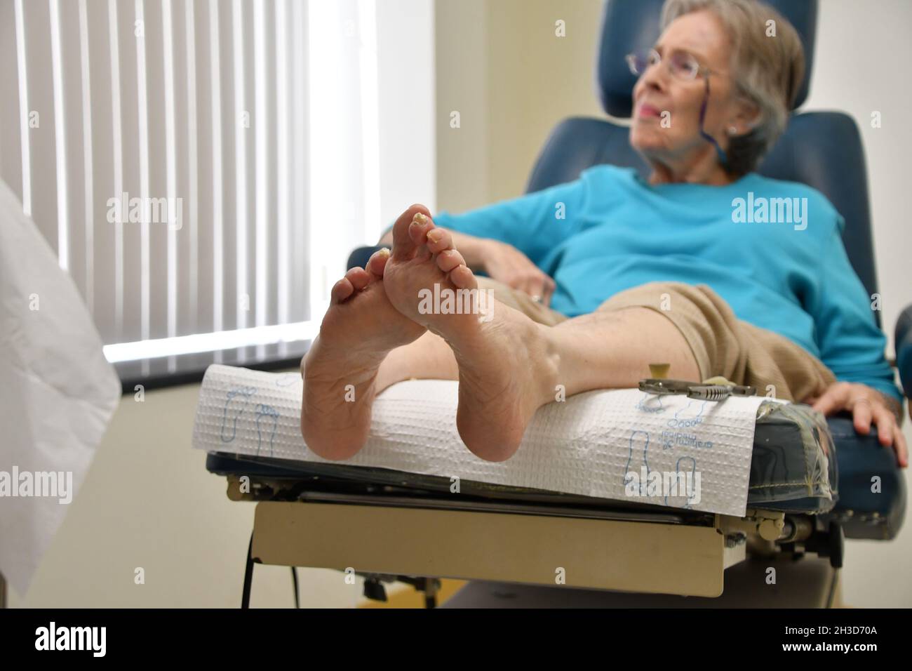 Female Geriatric Podiatrist doctor visit Stock Photo - Alamy