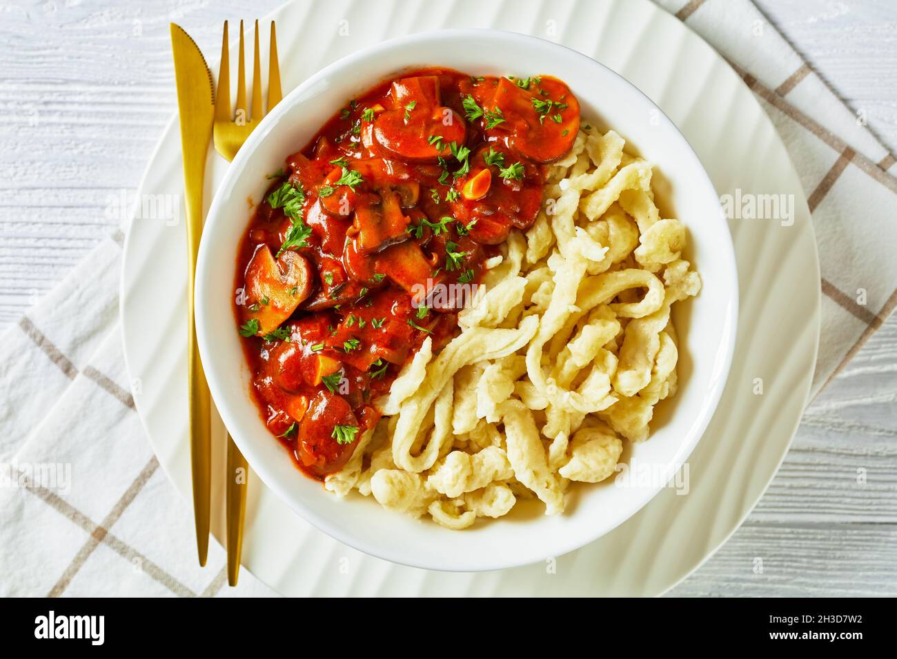 spaetzle with mushroom gravy in a white bowl, jagerspatzle ...