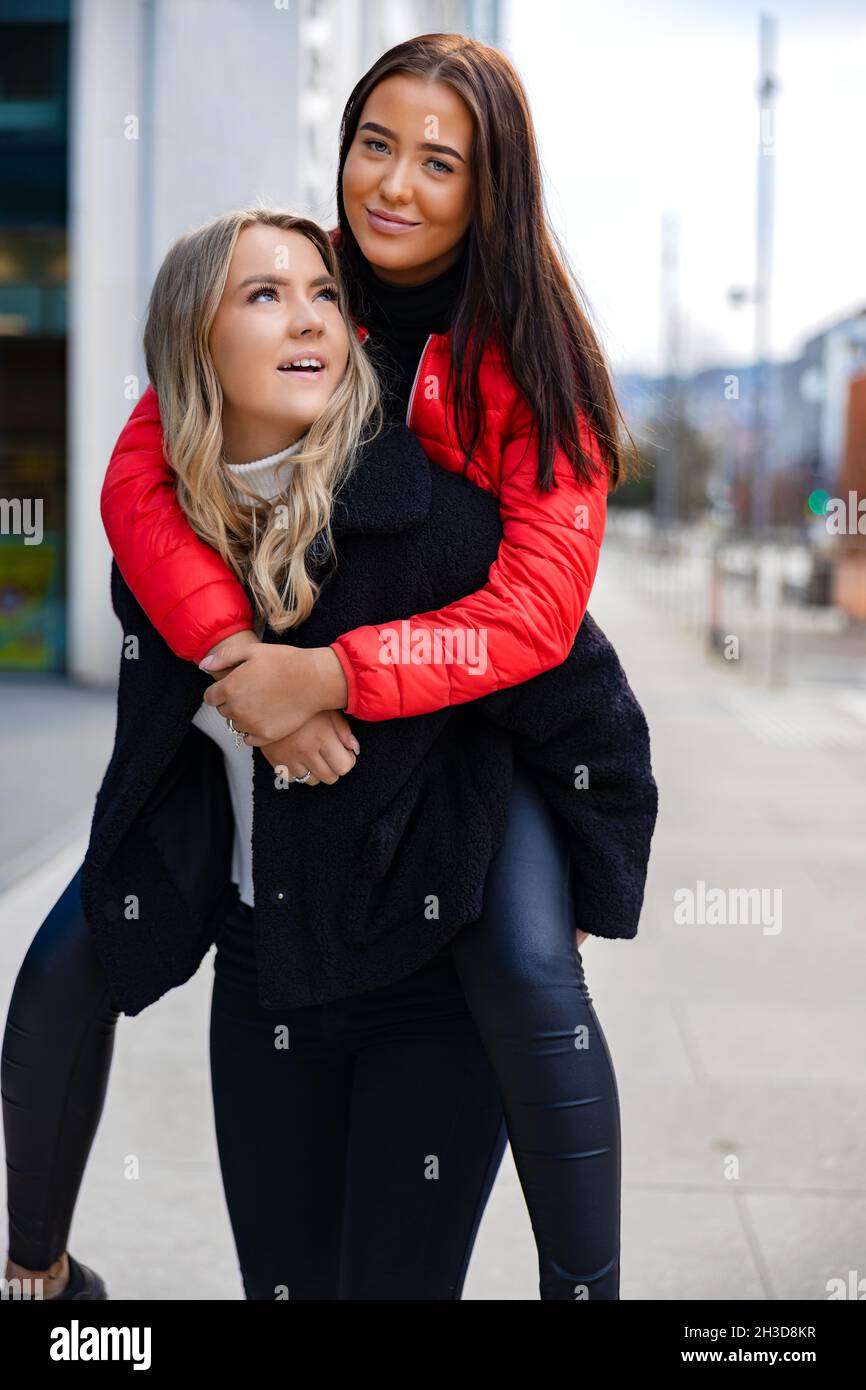 Female friends standing having hi-res stock photography and images - Alamy