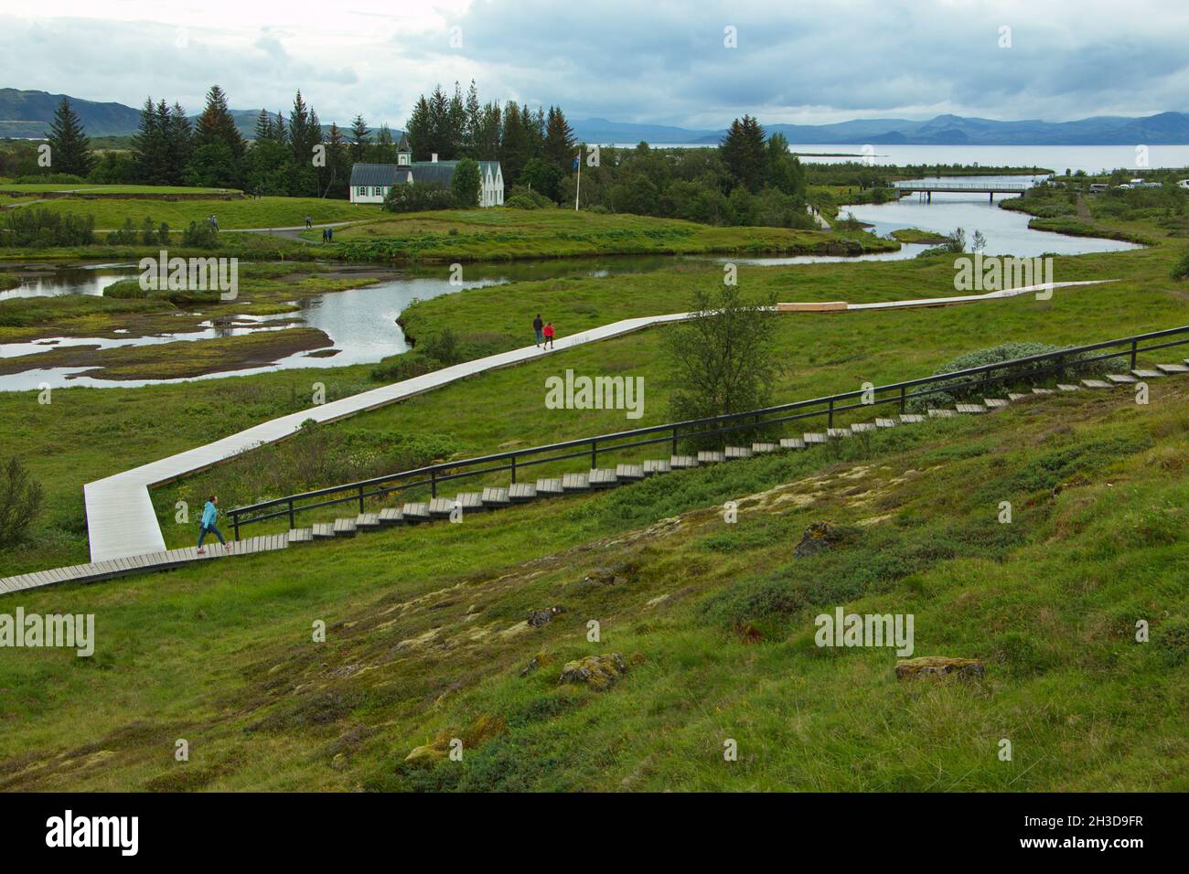 Church Thingvallakirkja and river Öxara in Thingvellir National Park on ...