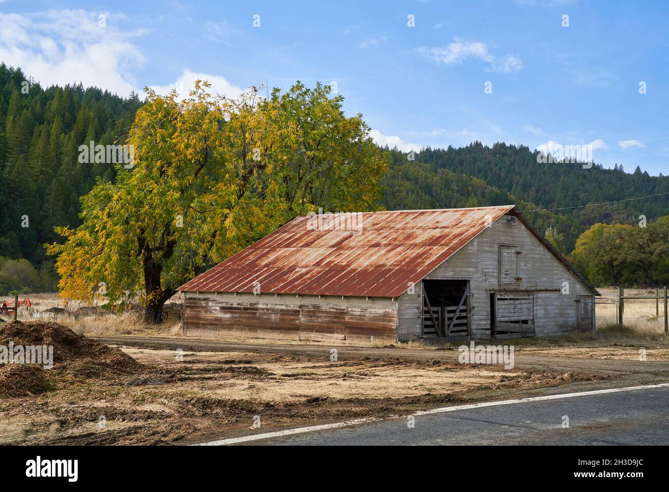 Wooden barn with rusty metal roof on a rural farm near Navarro ...