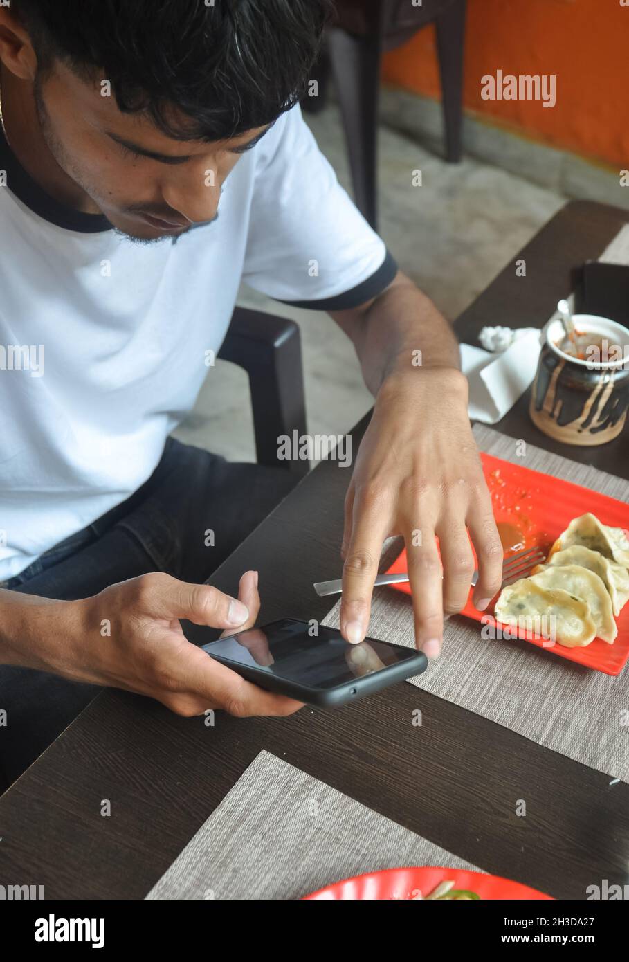 Indian people checking phone hi-res stock photography and images - Alamy