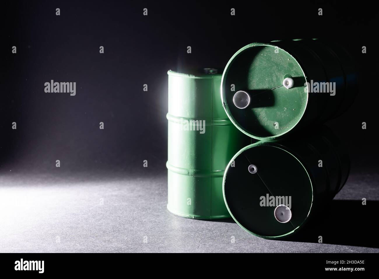 tin barrels on black background isolated close up, one round oil drum ...