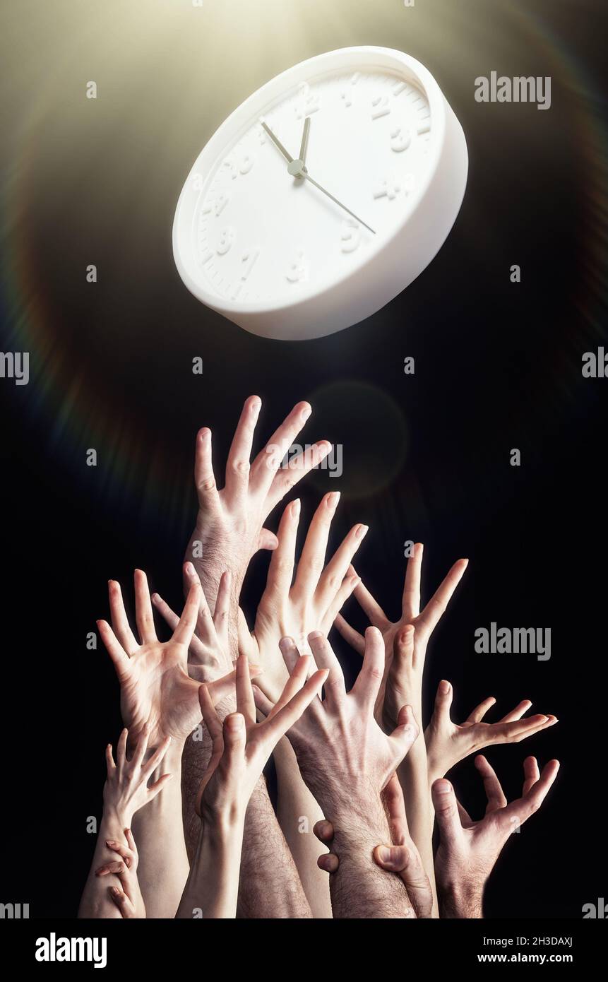Time management. A crowd of people is drawn to the light and the clock ...