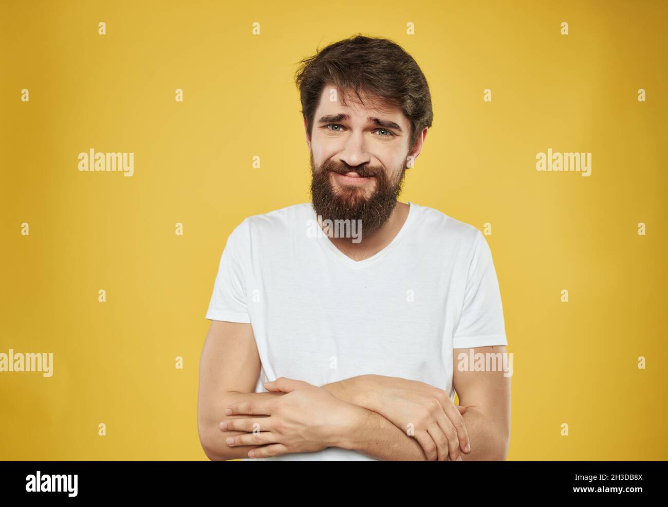 Man in a white t-shirt irritated facial expression close-up Stock Photo ...