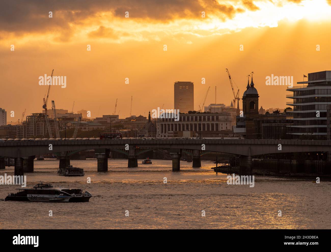 Sunset on the River Thames, looking towards London Bridge from Tower ...