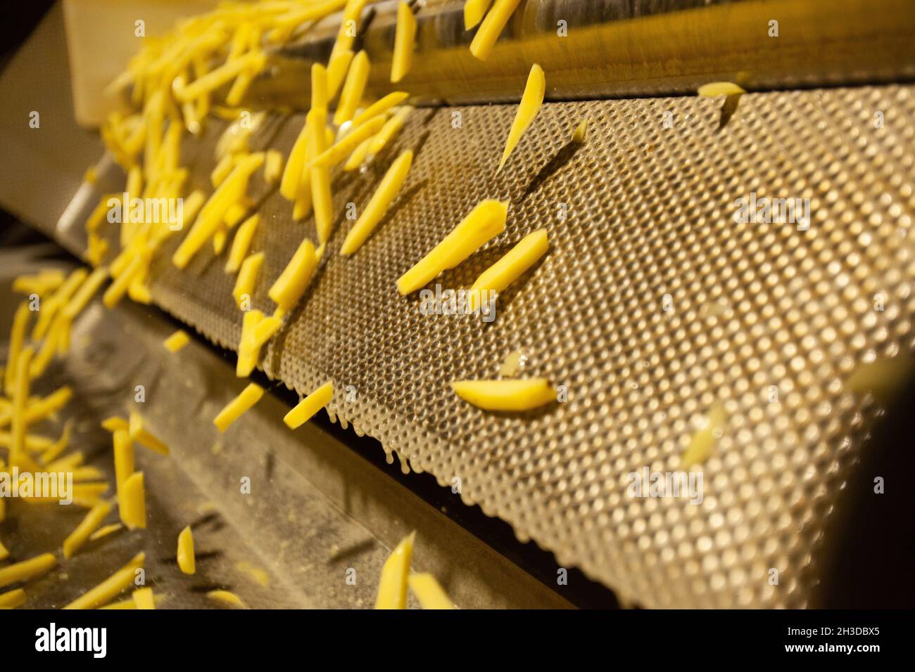 Production line of a potato factory. French fries - fast food Stock ...