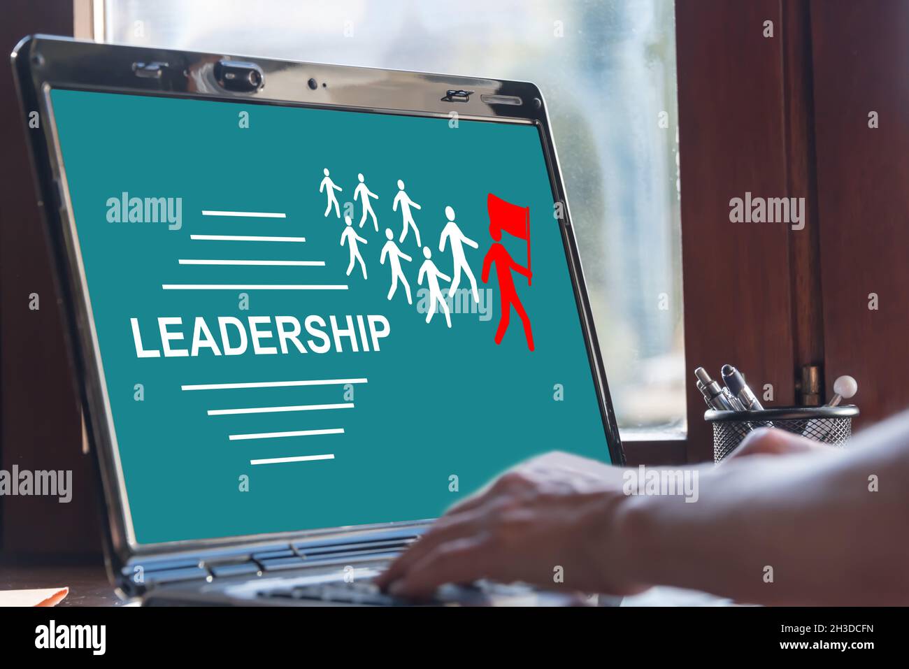 Laptop screen displaying a leadership concept Stock Photo - Alamy