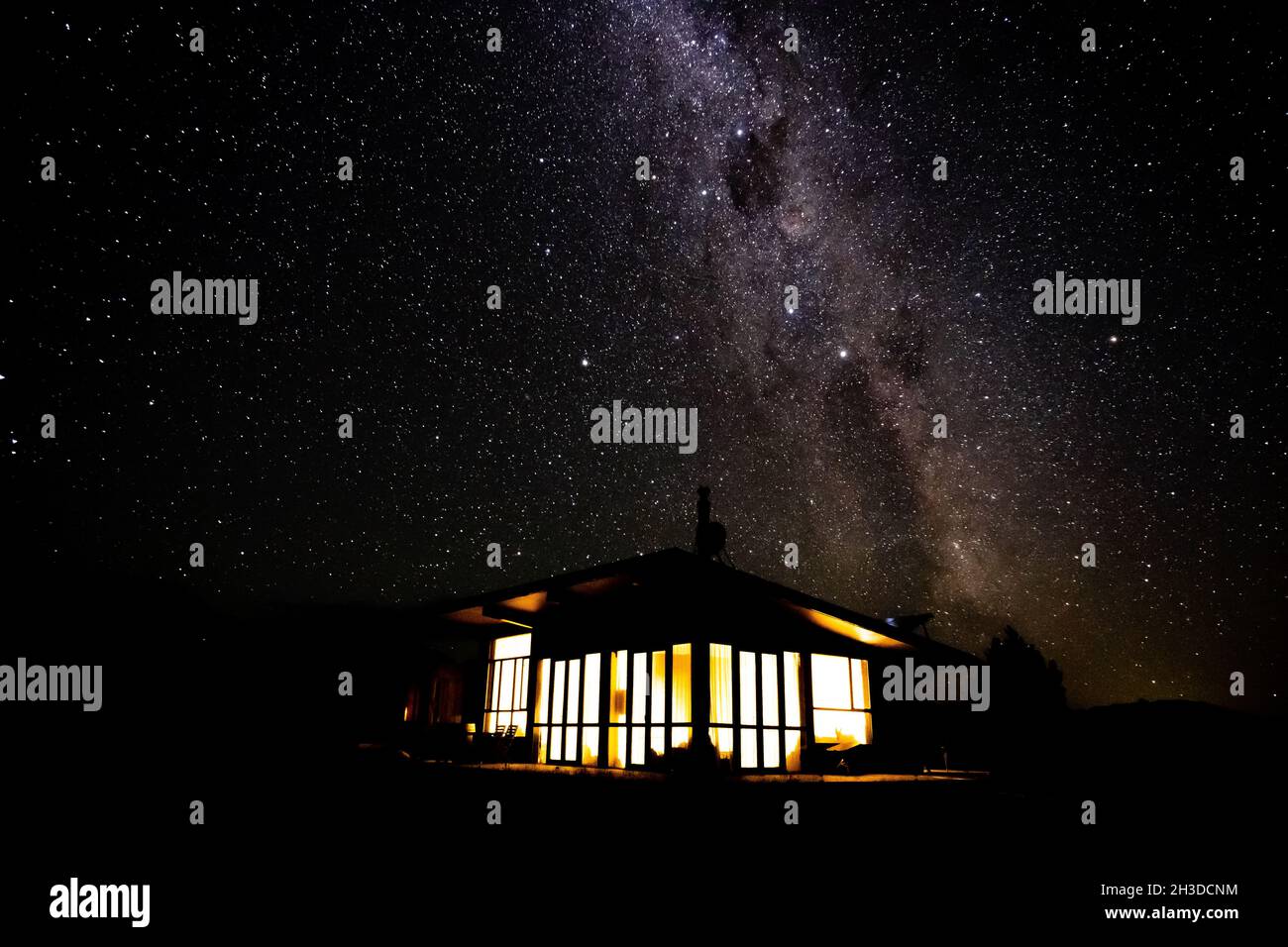 Rural brick house on a starry night Stock Photo - Alamy