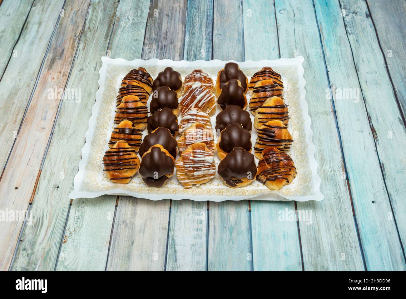 Tray of mini croissants with dark chocolate, grated white chocolate and ...