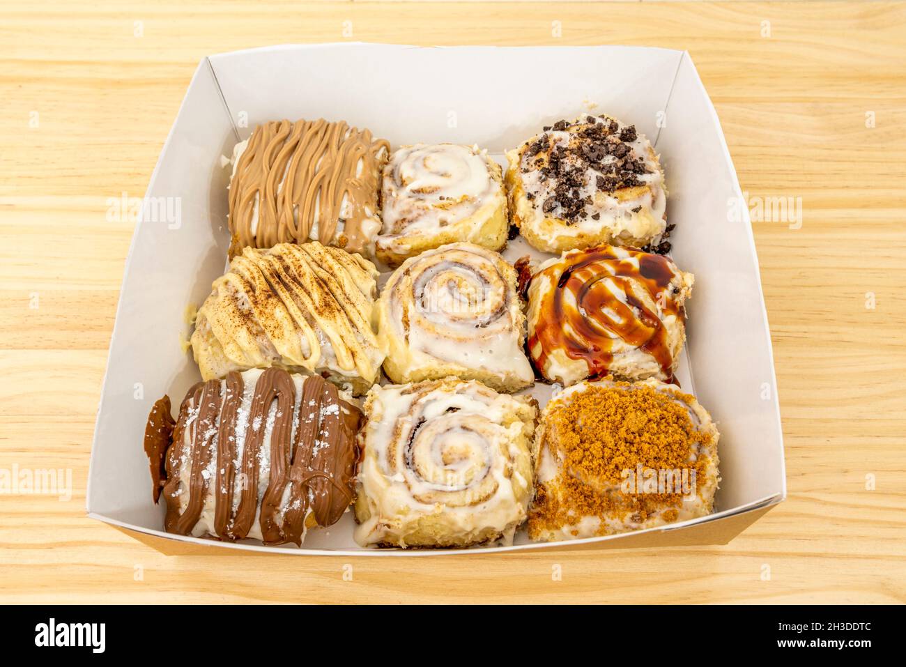 Assorted cinnamon roll take away box Stock Photo - Alamy