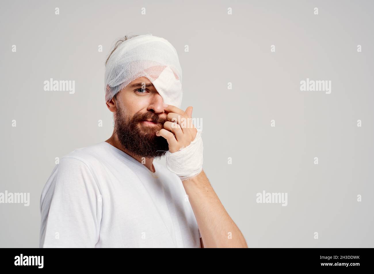 male patient with bandaged head and eye hospitalization light ...