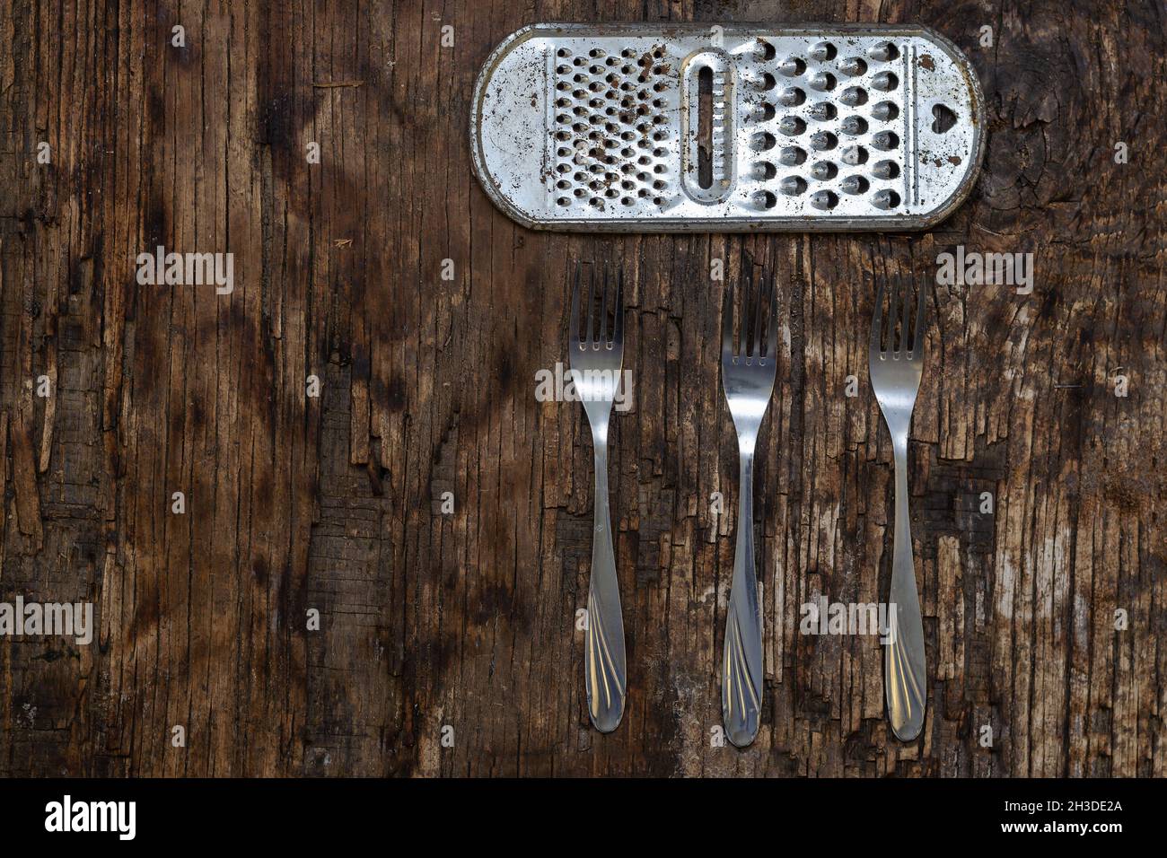 Old Metal kitchen utensils. Three stainless steel forks. Rusty kitchen ...