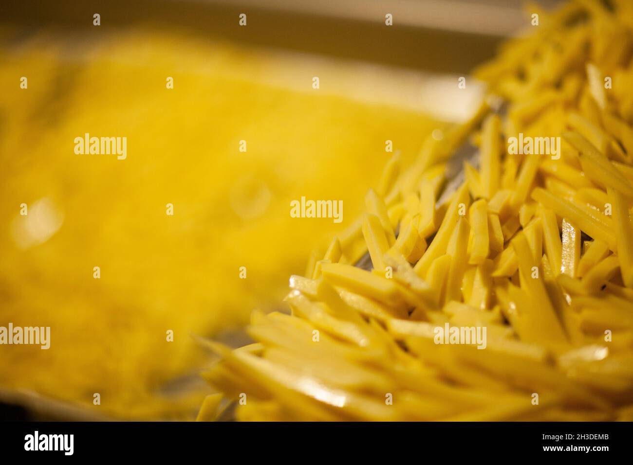 Production line of a potato factory. French fries - fast food Stock ...